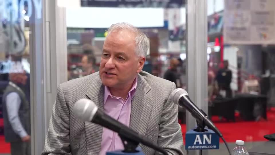 CDK CEO Brian MacDonald talks during the NADA Show